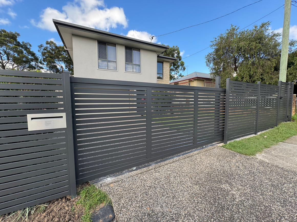 Horizontal Slat Sliding Gate | Raked Bottom Gate for Sloped Driveways ...